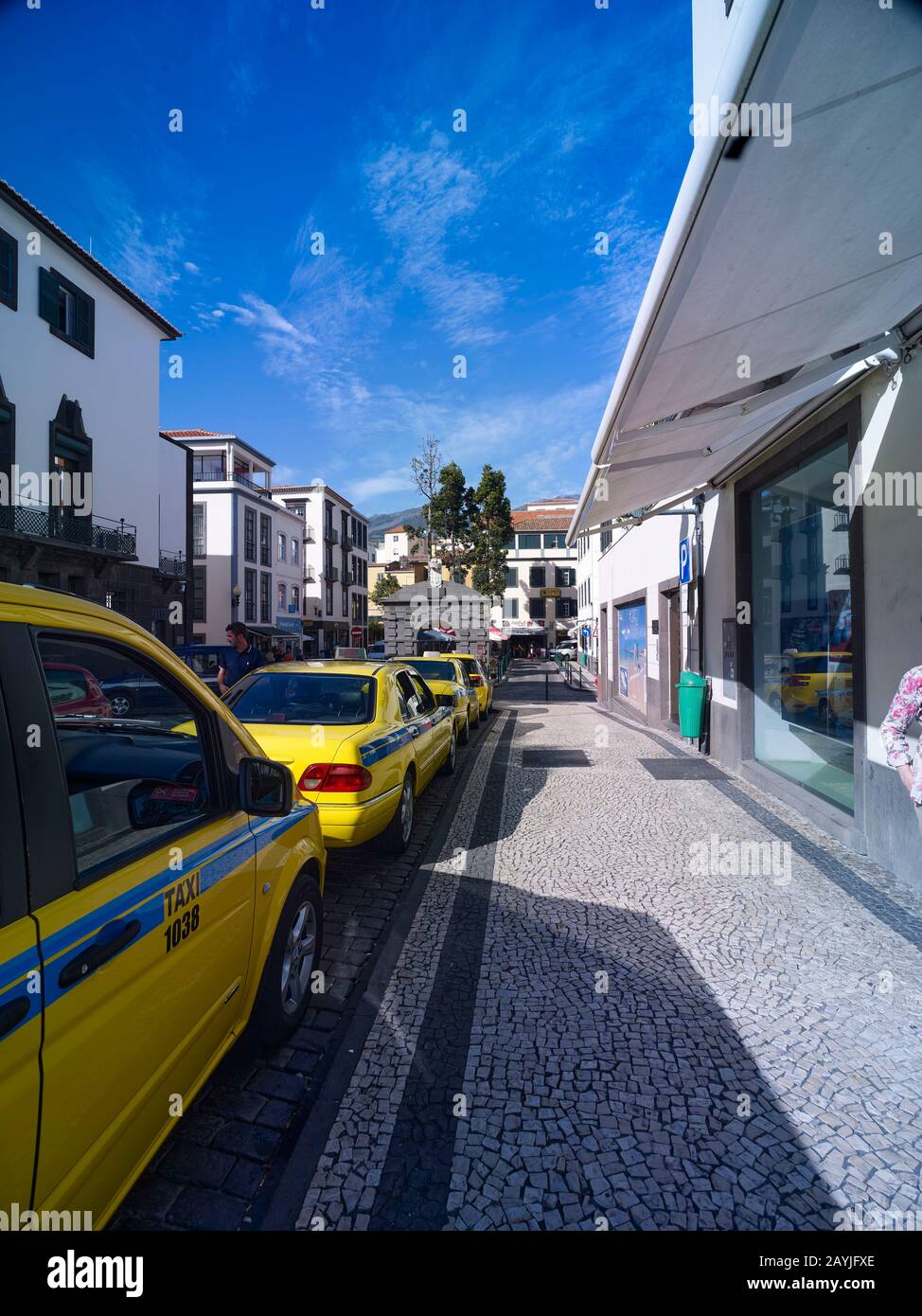 Old town Funchal, Zone velha, with yellow taxis in February sunshine ...