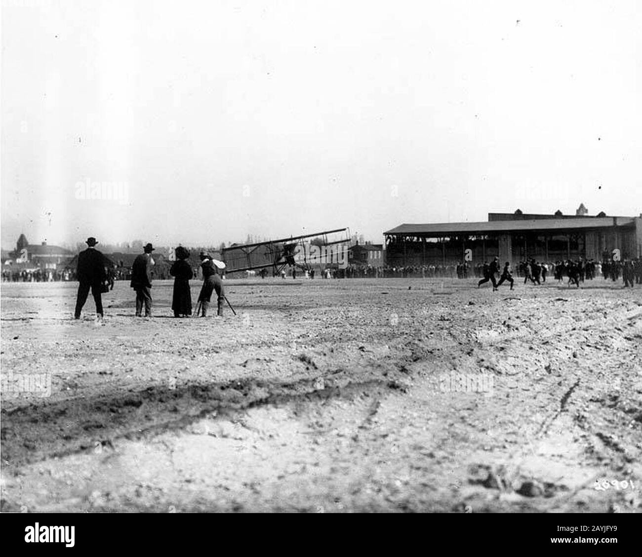 Fred J Wiseman piloting the first airplane (biplane) to land at the ...