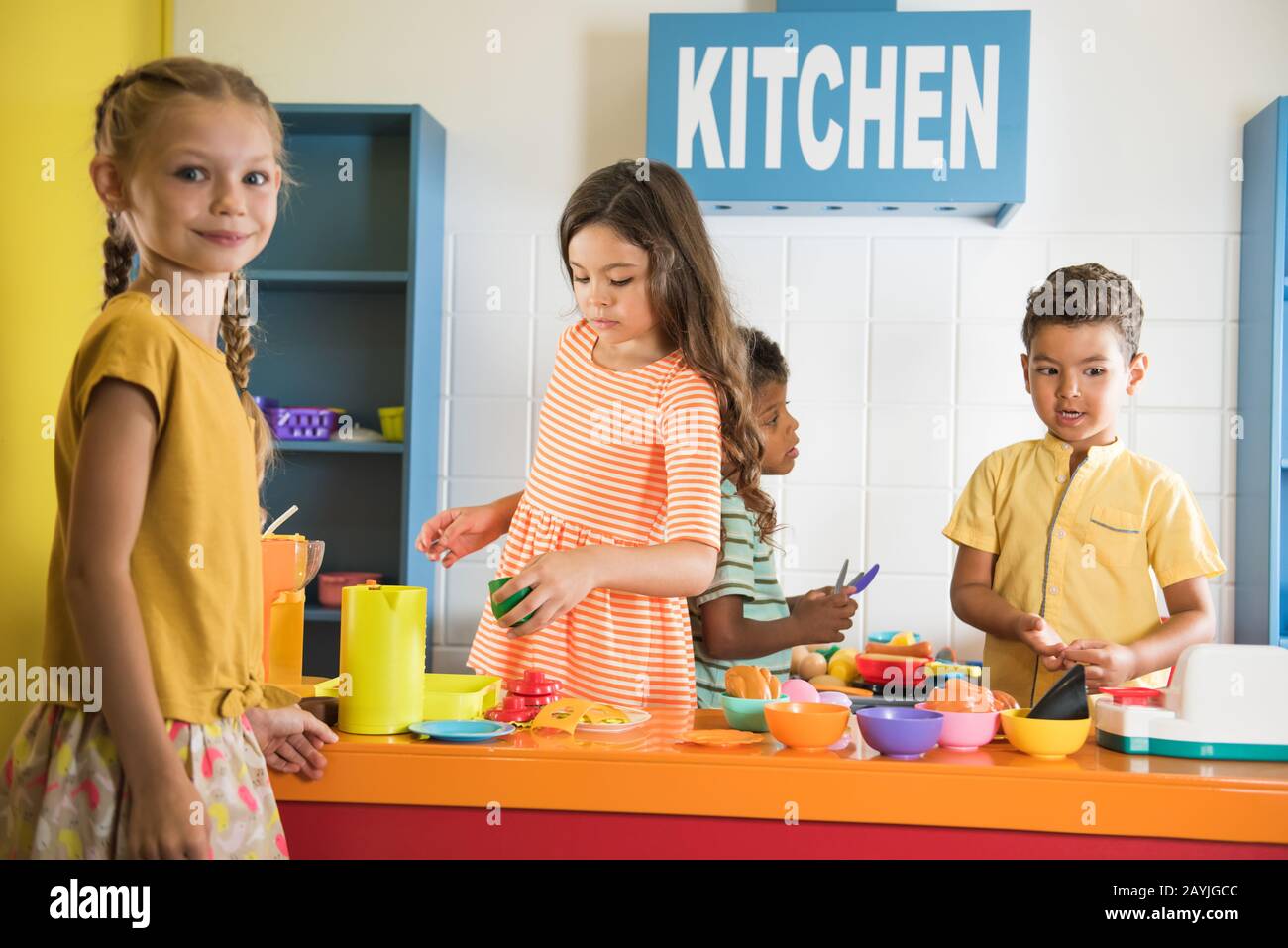 Kids playing game dinner table hi-res stock photography and images - Alamy