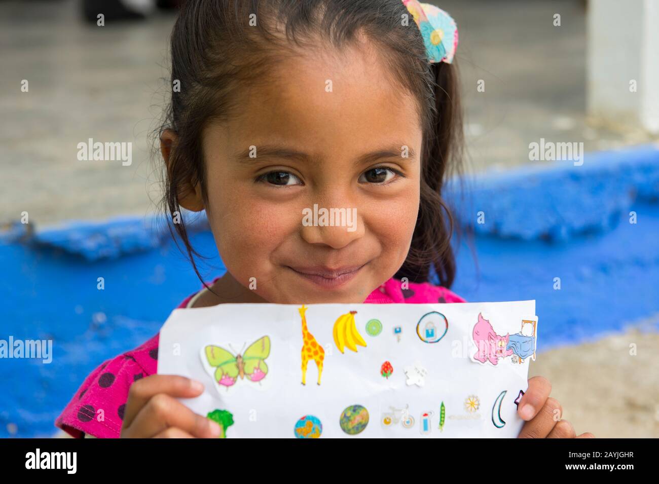 A girl is showing her artwork in the Mixtec village of San Juan ...
