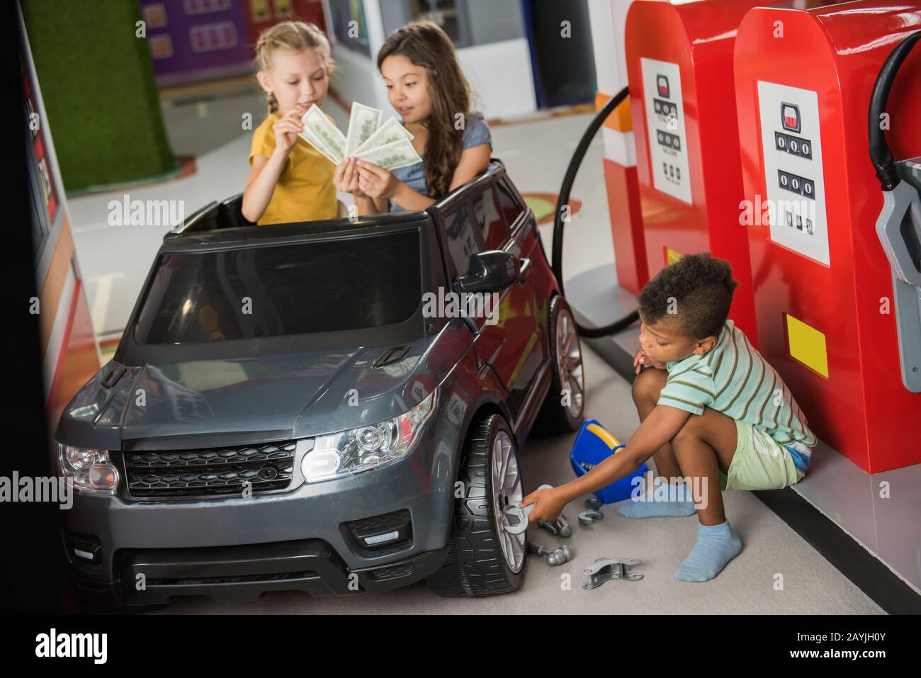 Children playing game in car hi-res stock photography and images - Alamy