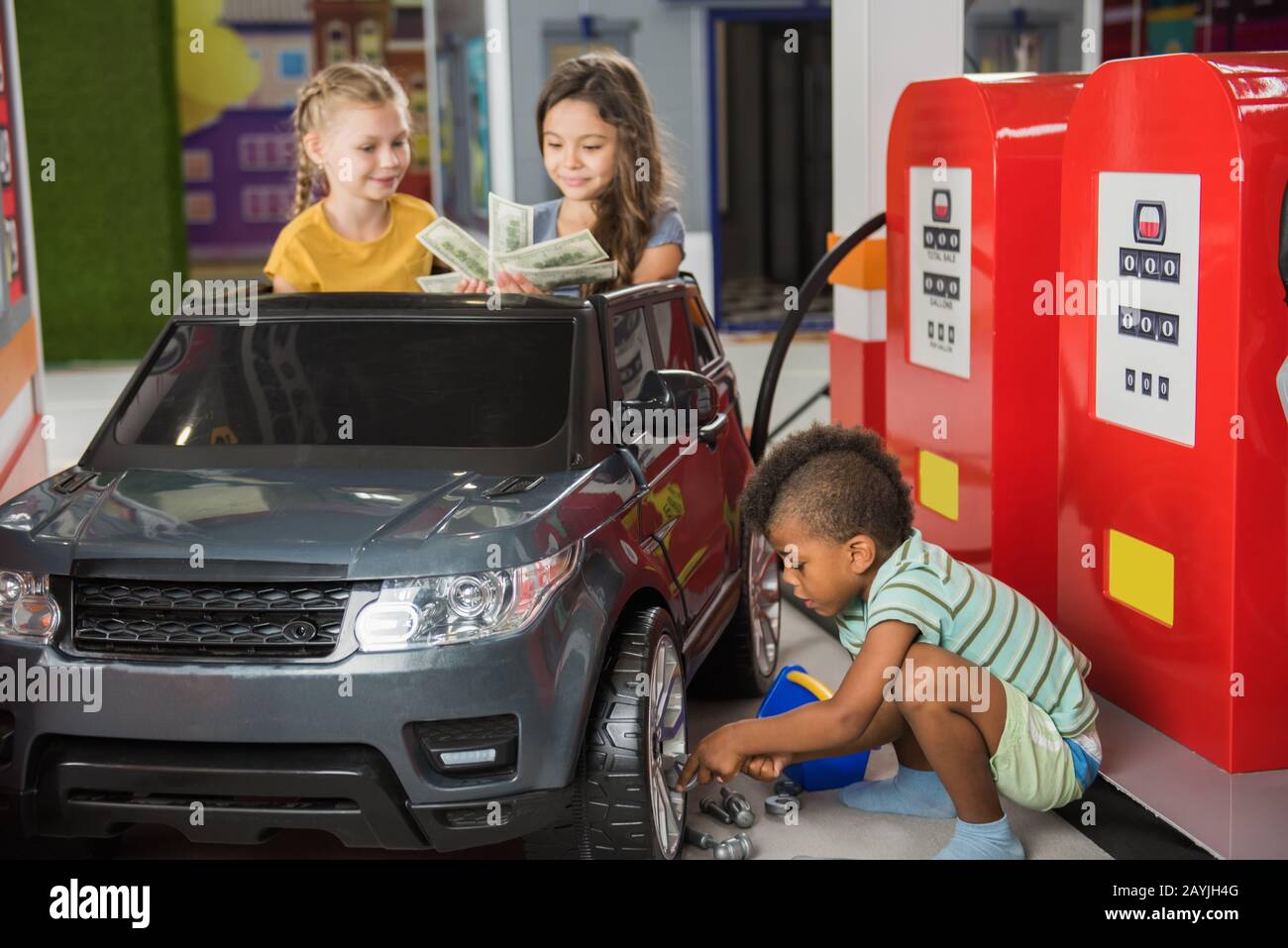 Kids at gas station in playroom Stock Photo - Alamy