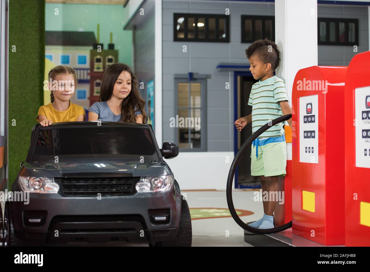 Kids at a gas station Stock Photo - Alamy