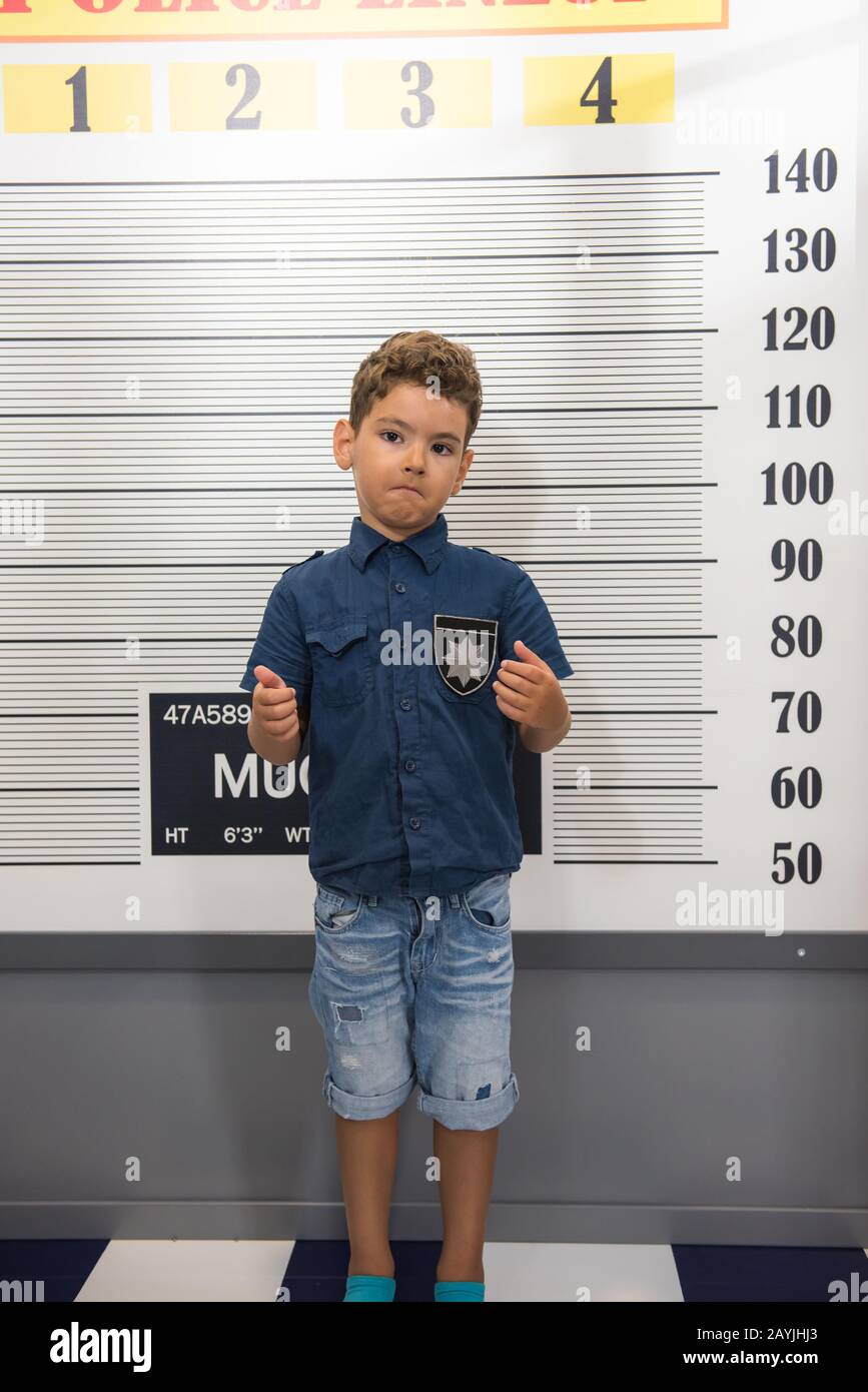 Little boy playing a thief Stock Photo - Alamy