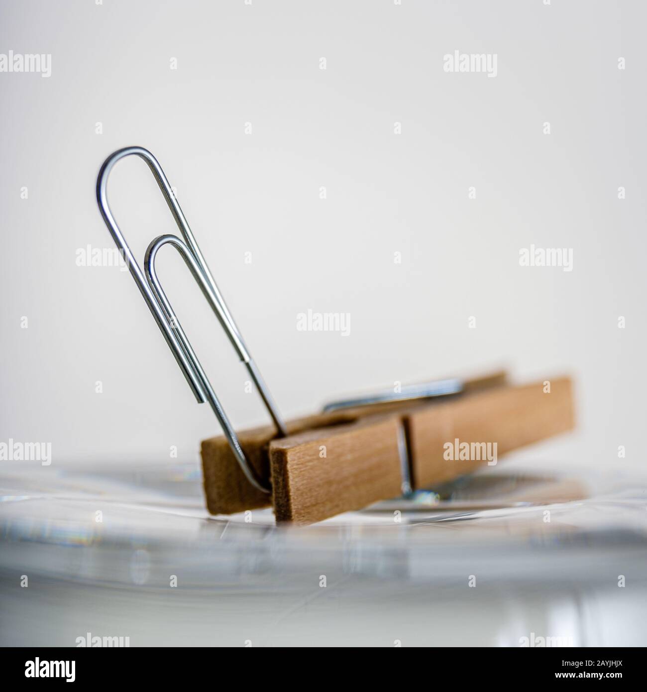 A paperclip and clothespin close-up in a white background Stock Photo ...