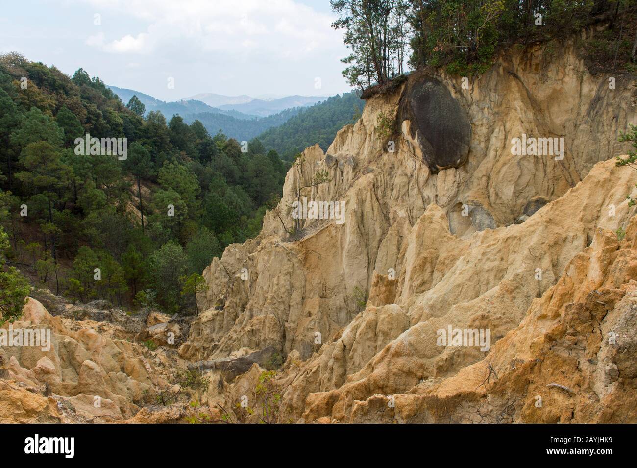 Hillside erosion caused by the collapse of an old goldmine in the hills ...