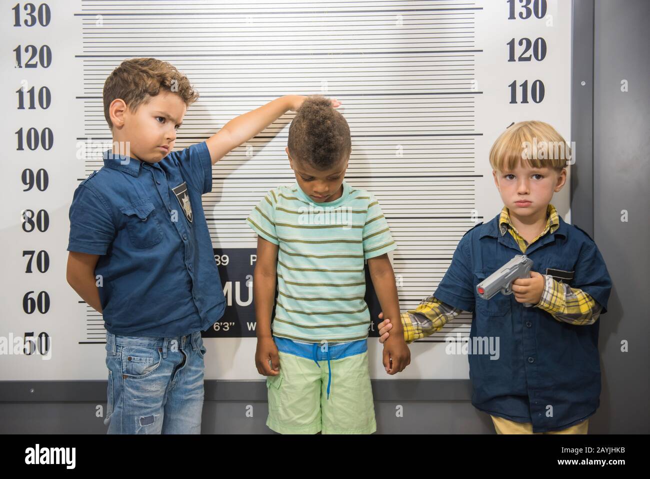 Kids playing police in amusement park Stock Photo - Alamy