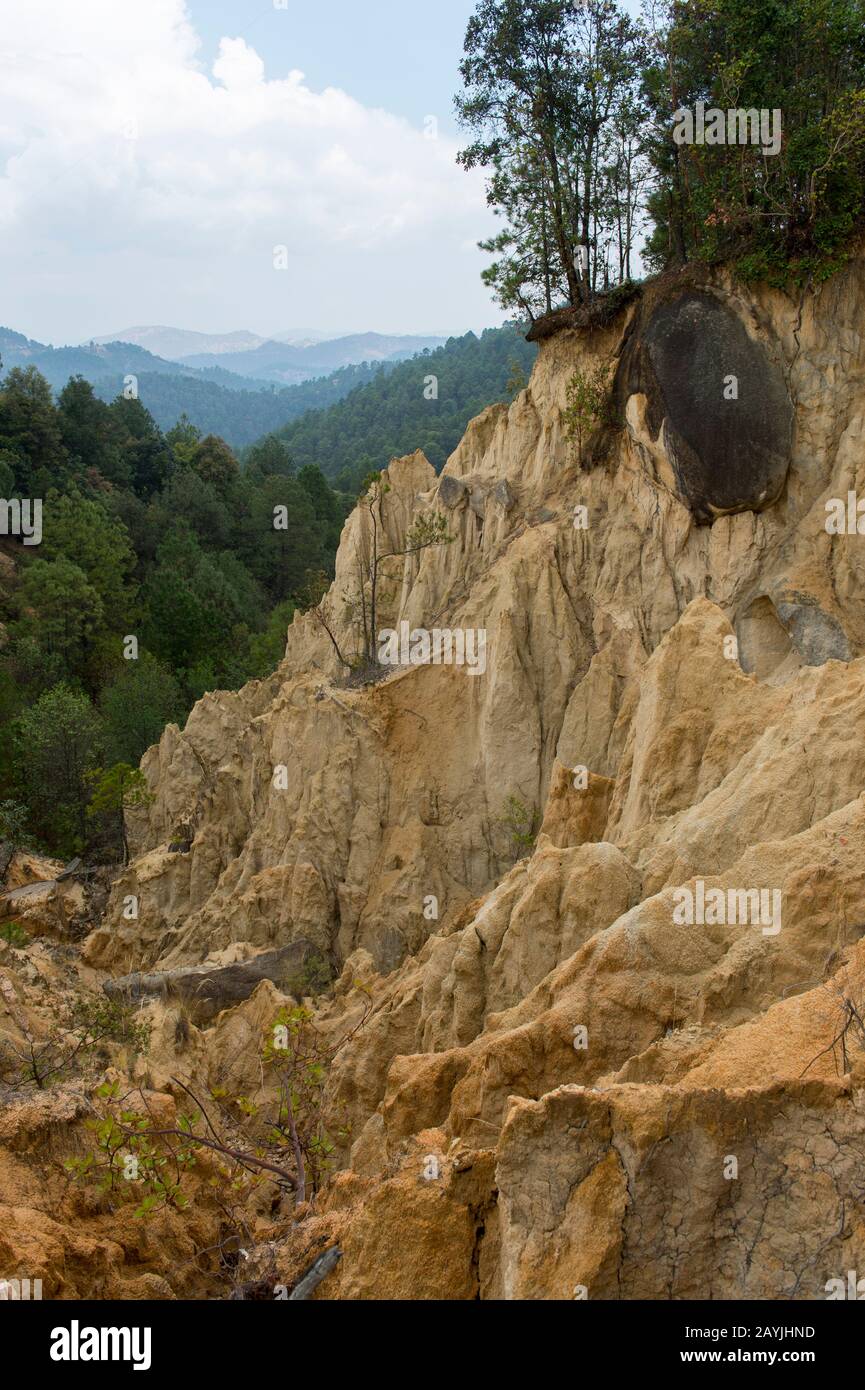Hillside erosion caused by the collapse of an old goldmine in the hills ...
