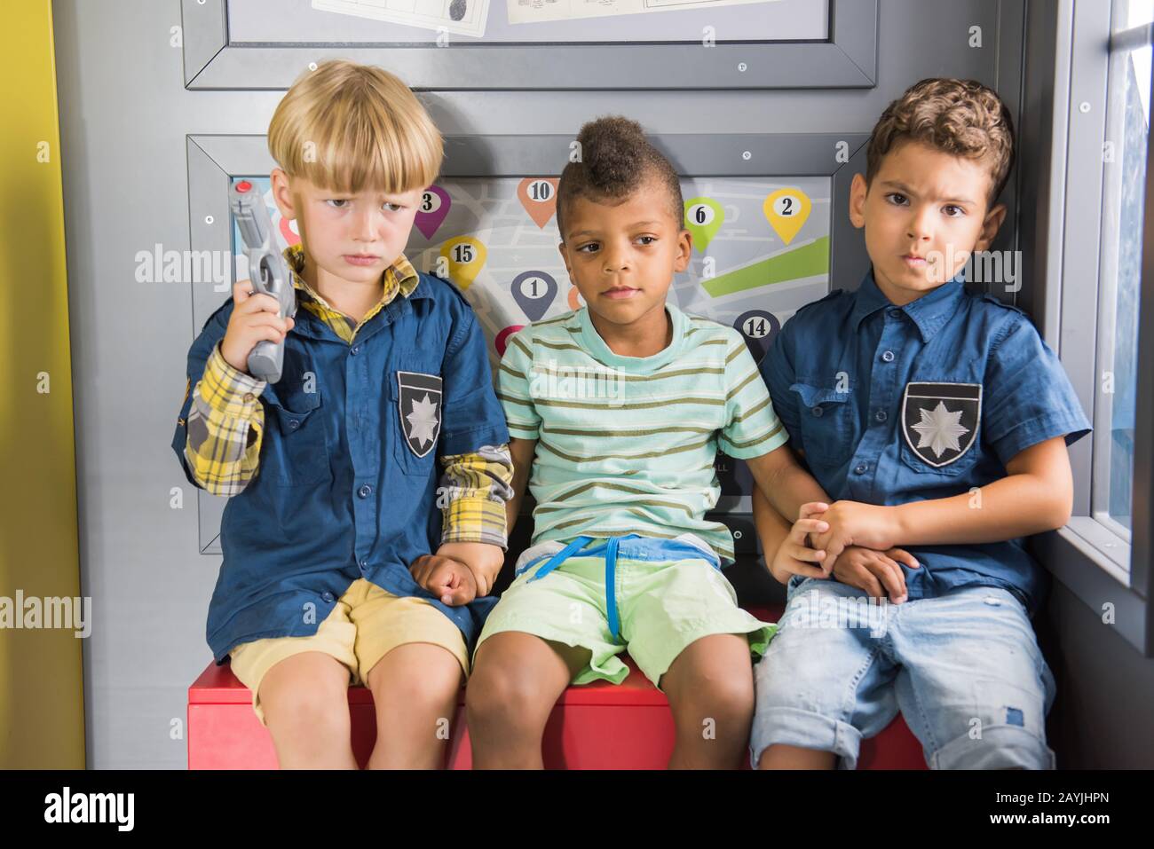 Kids playing police indoor Stock Photo - Alamy