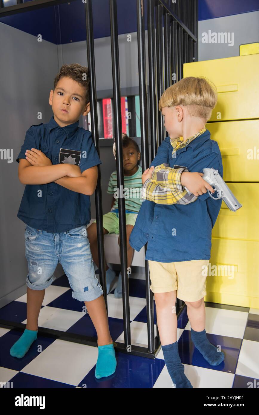 Kids playing police at childrens game center Stock Photo - Alamy