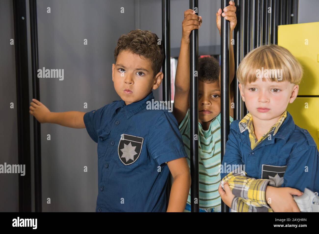 Cute kids playing police in childrens center Stock Photo - Alamy