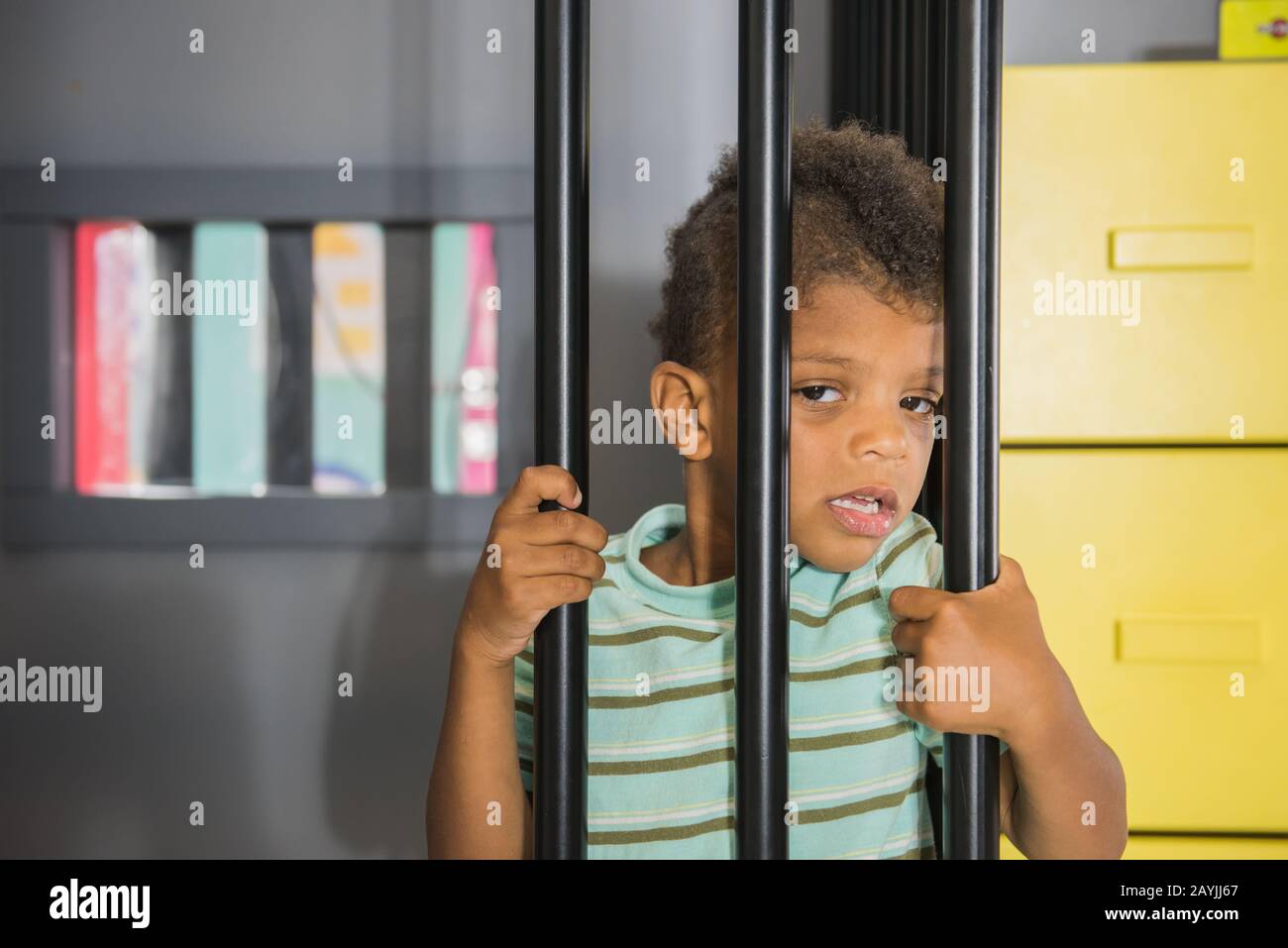 Kid prisoner try to escape from jail Stock Photo - Alamy