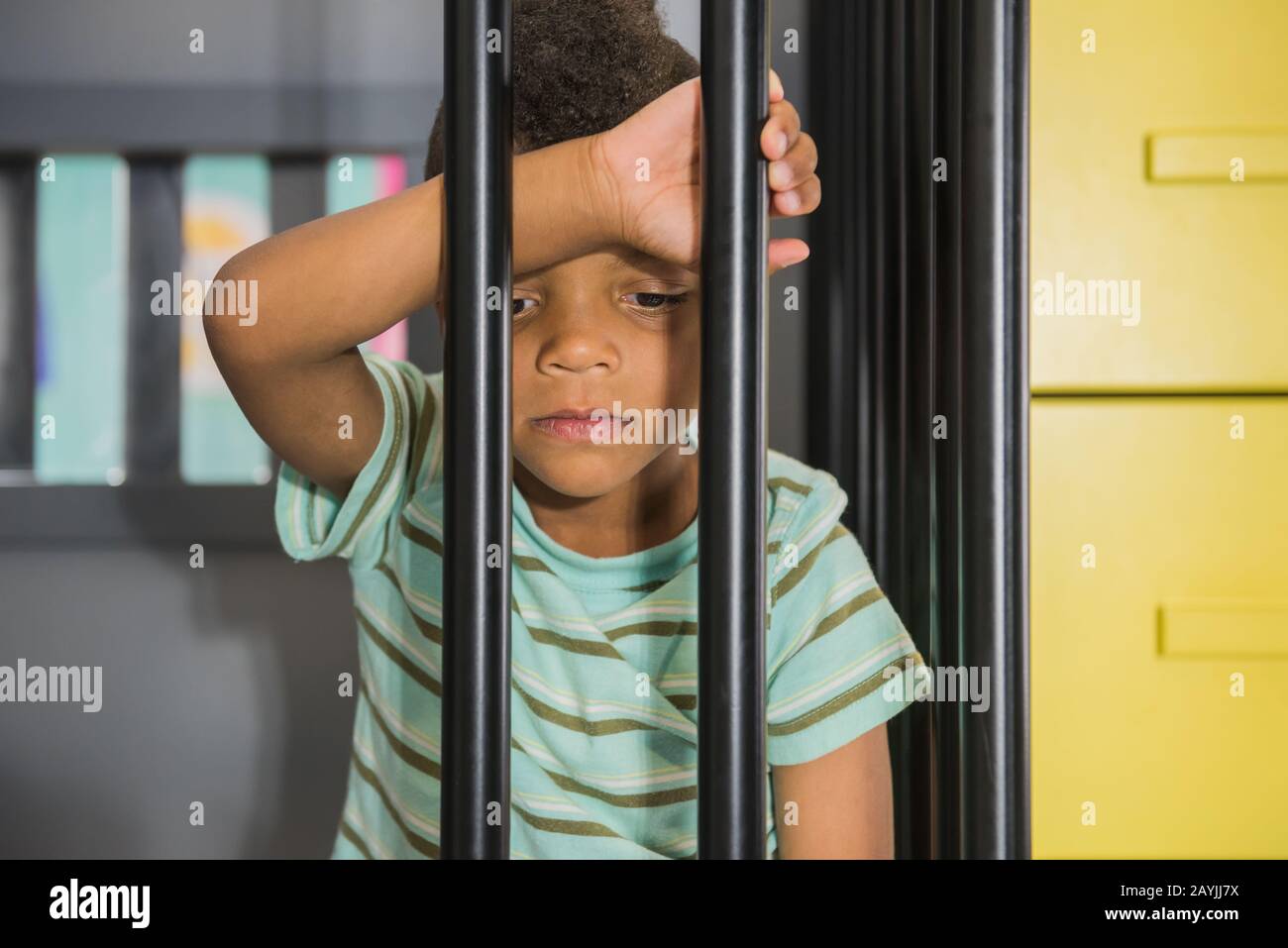 Kid prisoner try to escape from jail Stock Photo - Alamy