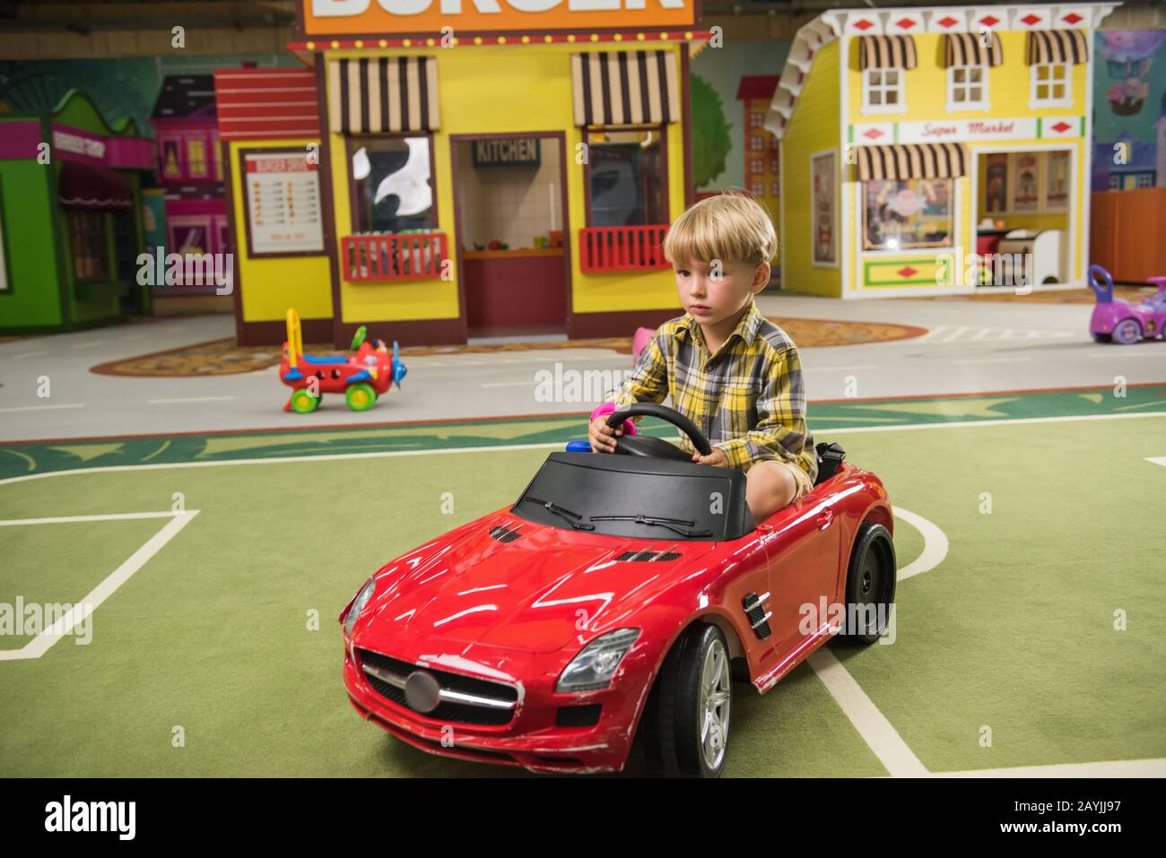 Boy riding car toy hi-res stock photography and images - Alamy