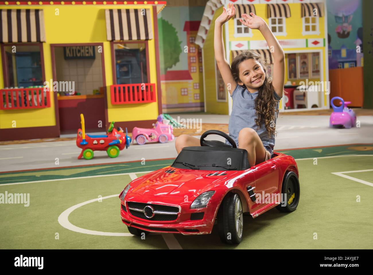 Elementary school girl at kids playroom Stock Photo - Alamy