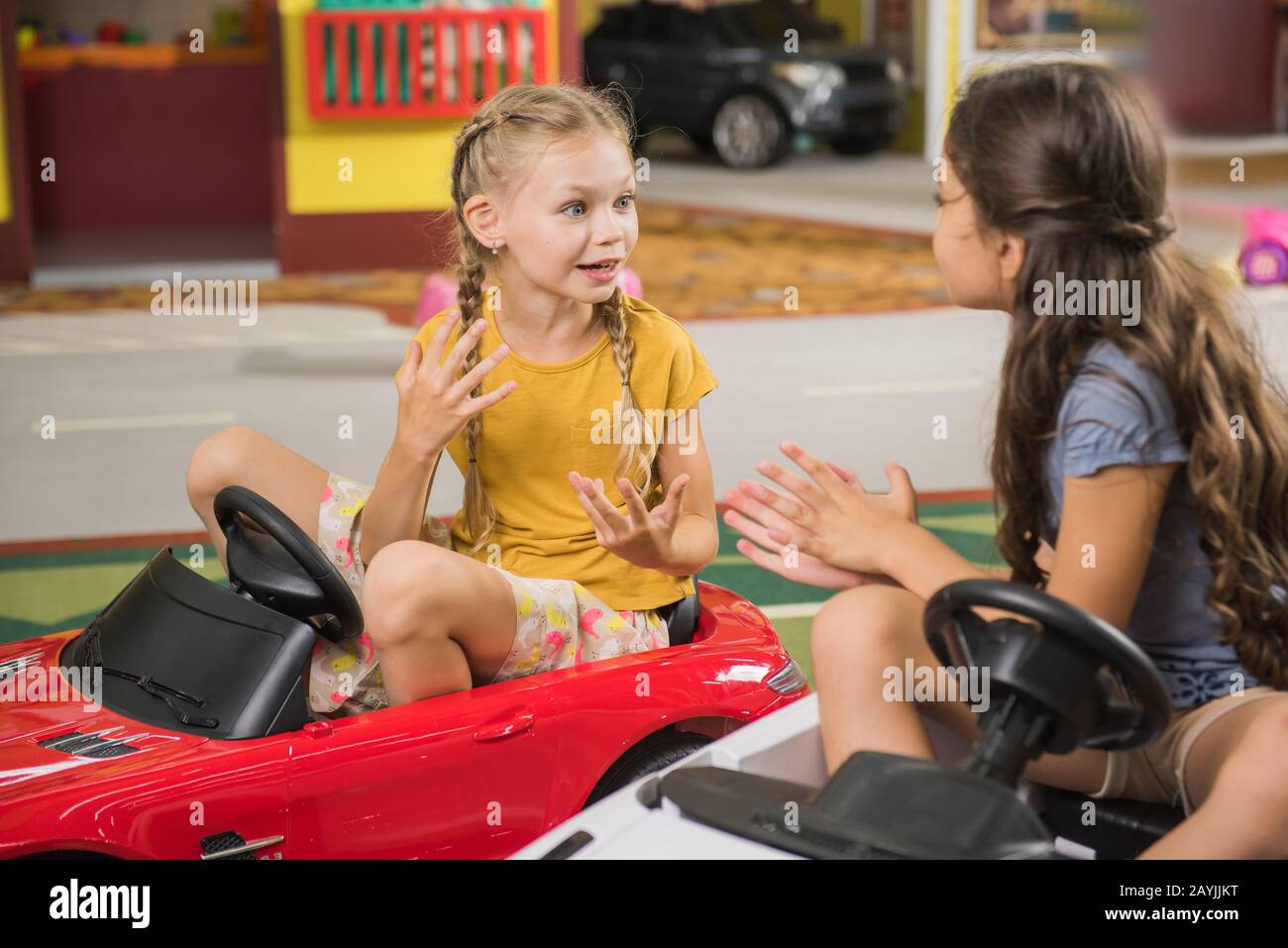Kids driving mini toy car indoor Stock Photo - Alamy