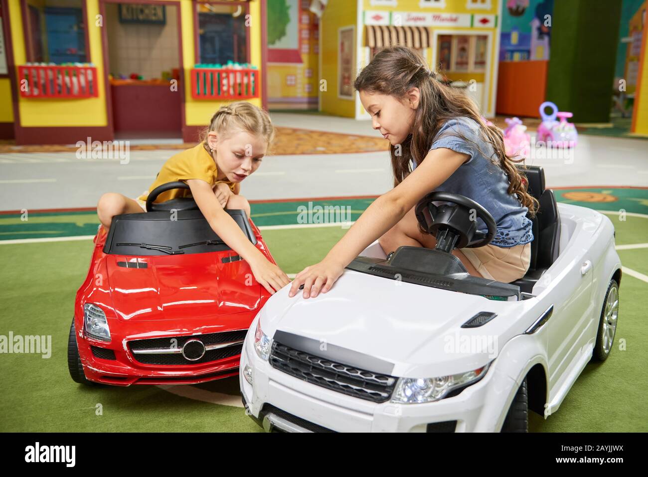 Kids having fun at game center Stock Photo - Alamy