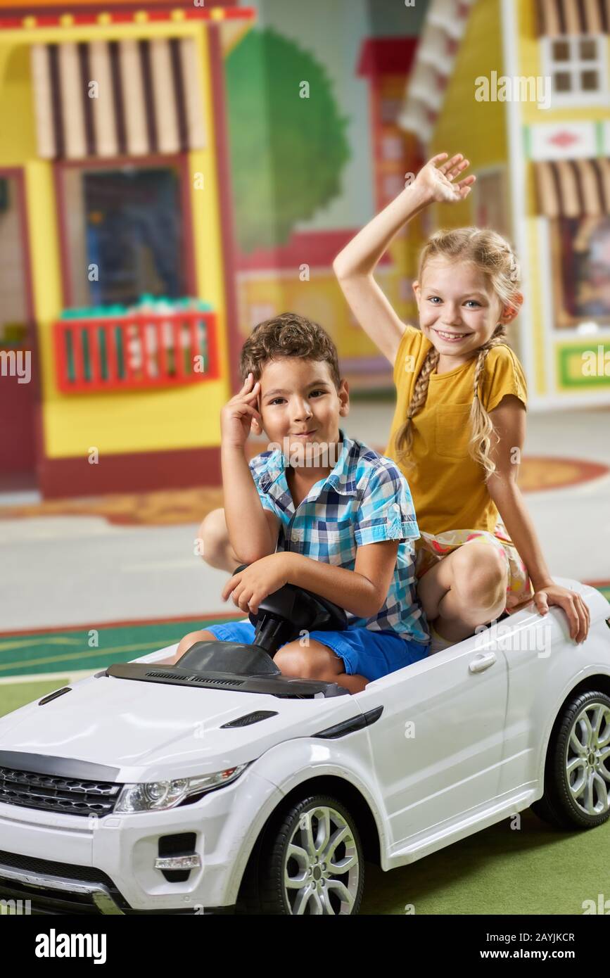 Two kids having fun in entertainment center Stock Photo - Alamy
