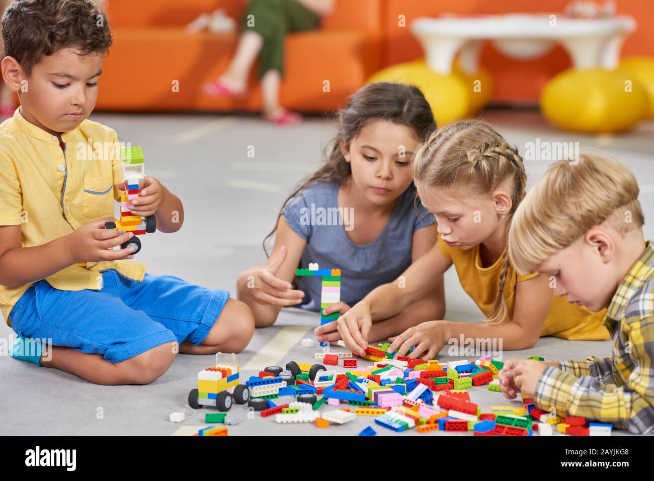 Kids are in entertainment center Stock Photo - Alamy