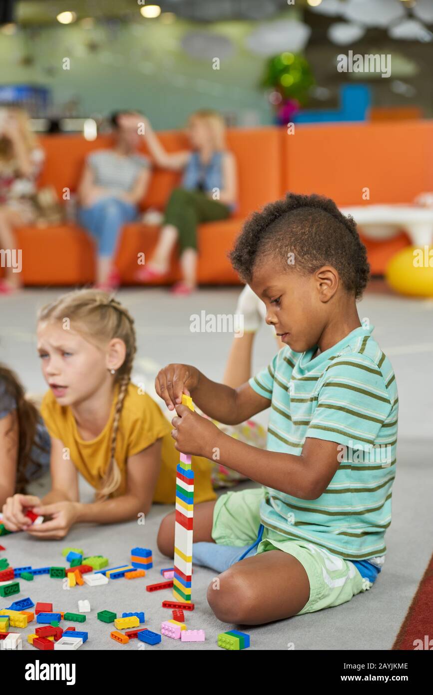 Kids playing with constructor toys Stock Photo - Alamy