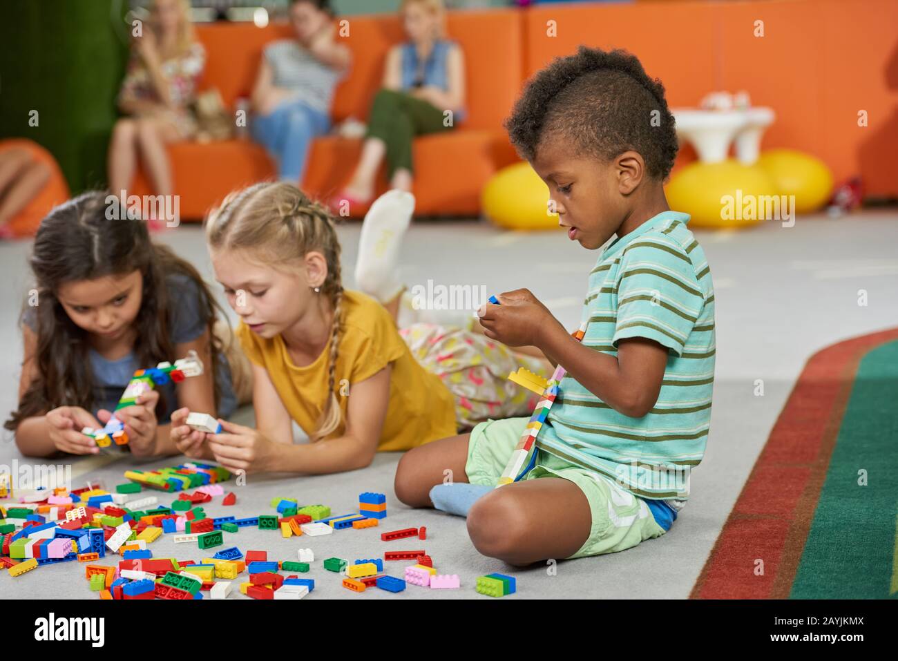 Kids playing with constructor toys Stock Photo - Alamy