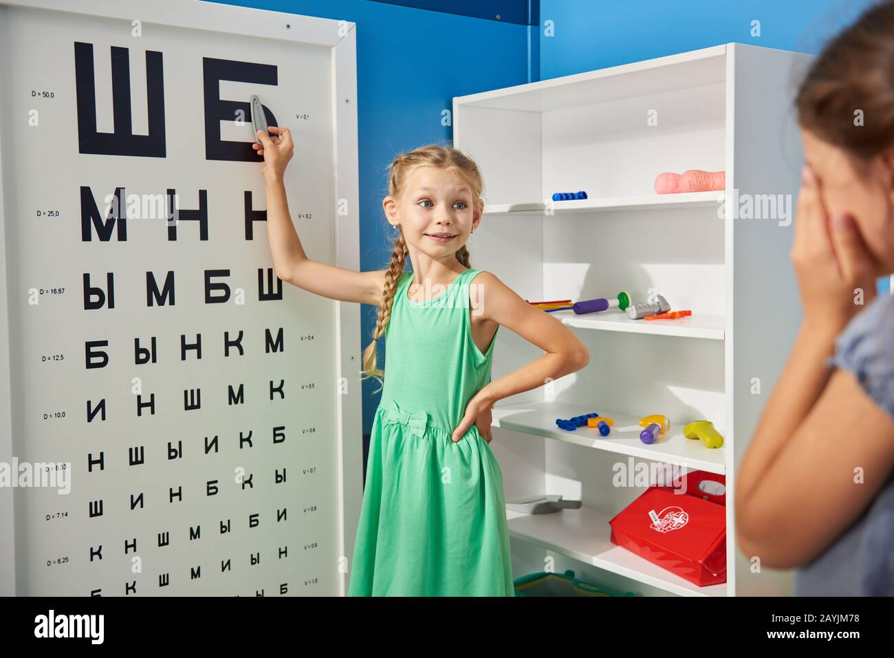 Kids playing doctor in playroom or kindergarten Stock Photo - Alamy