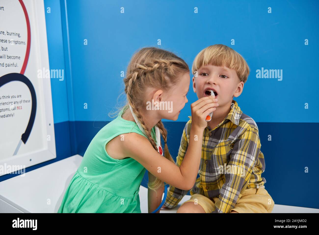 Kids playing doctor and patient Stock Photo - Alamy