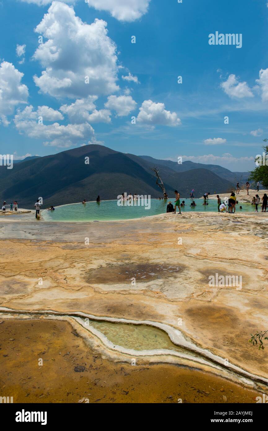 People bathing in the artificial pool filled with water from fresh ...