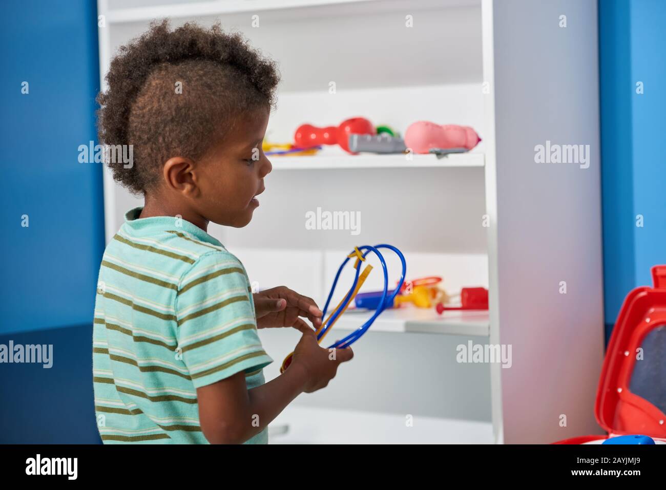 Boy playing doctor at medical office Stock Photo - Alamy