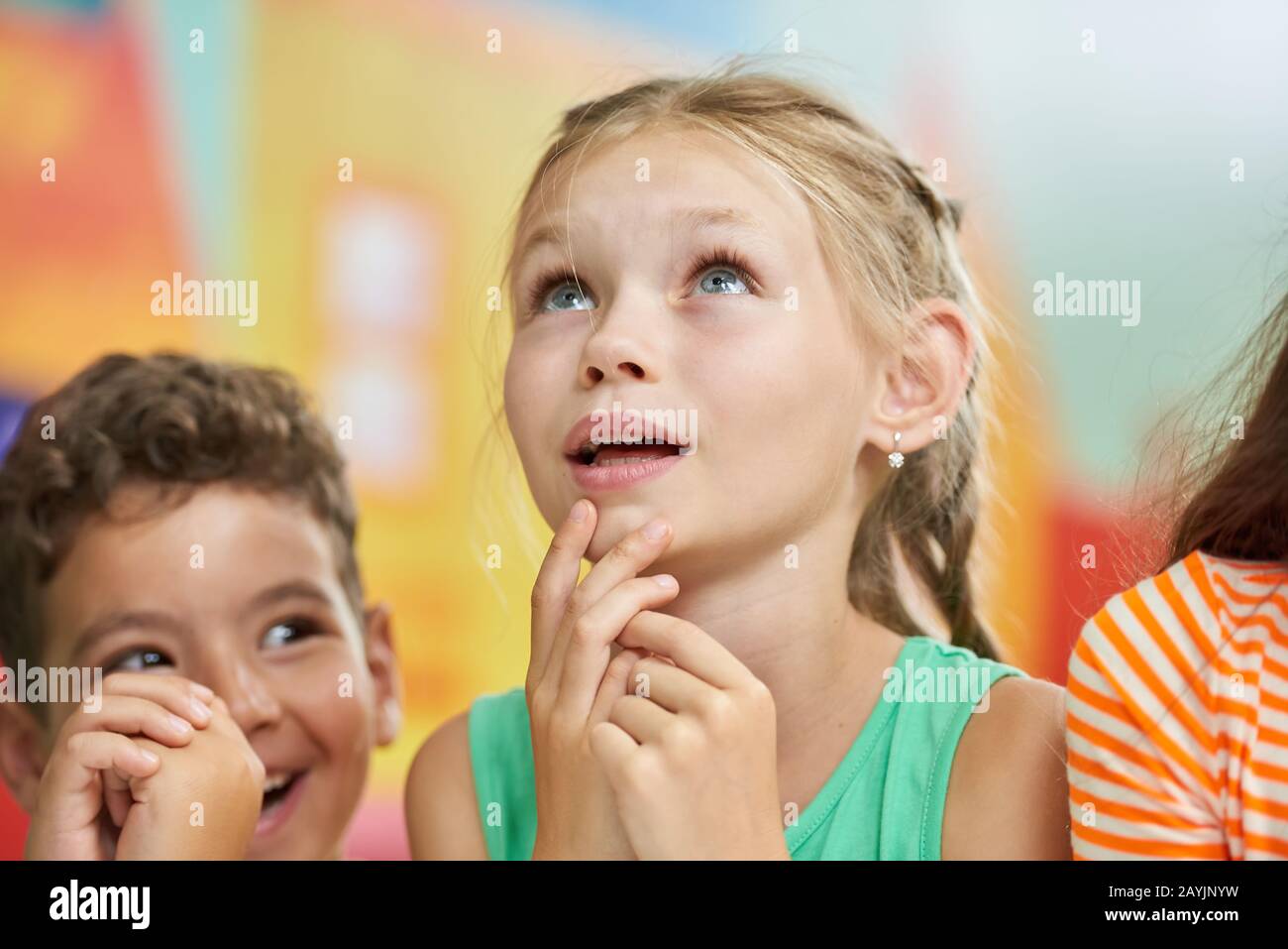 Pensive child looking up Stock Photo - Alamy