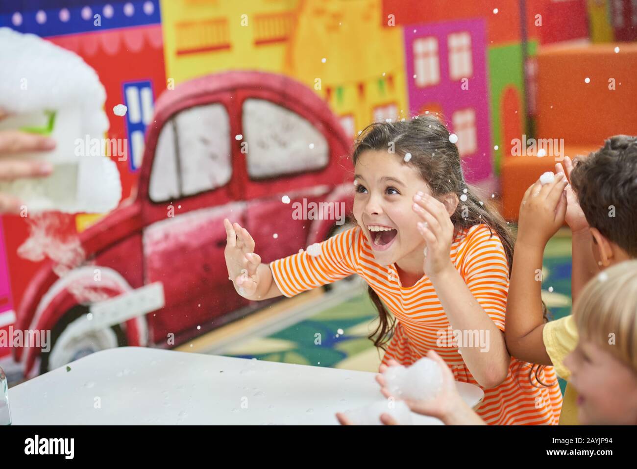 Joyful kids watching dry ice boo bubbles experiment Stock Photo - Alamy