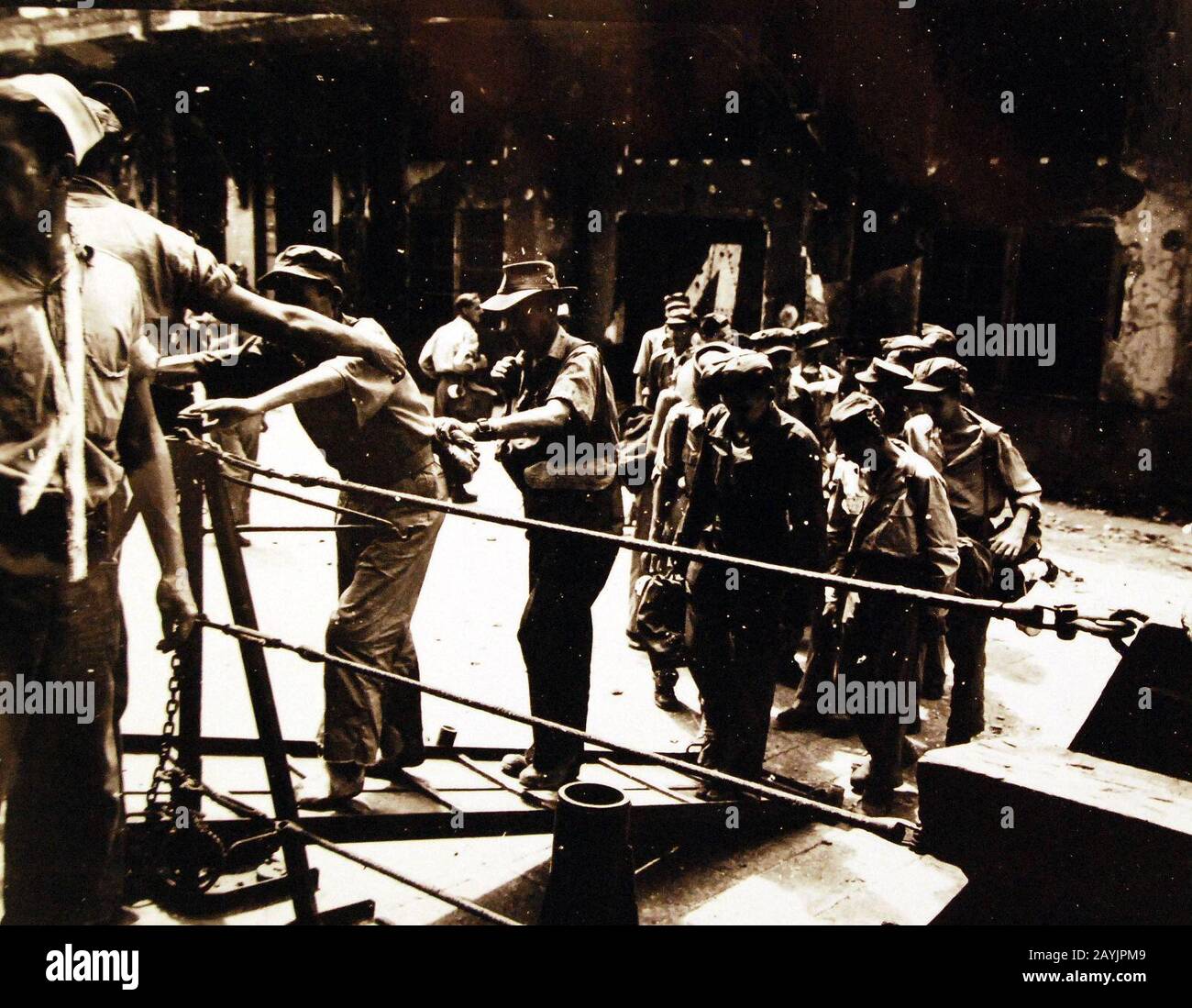 Freed British and Australian prisoners of war go aboard USS Thomas E ...