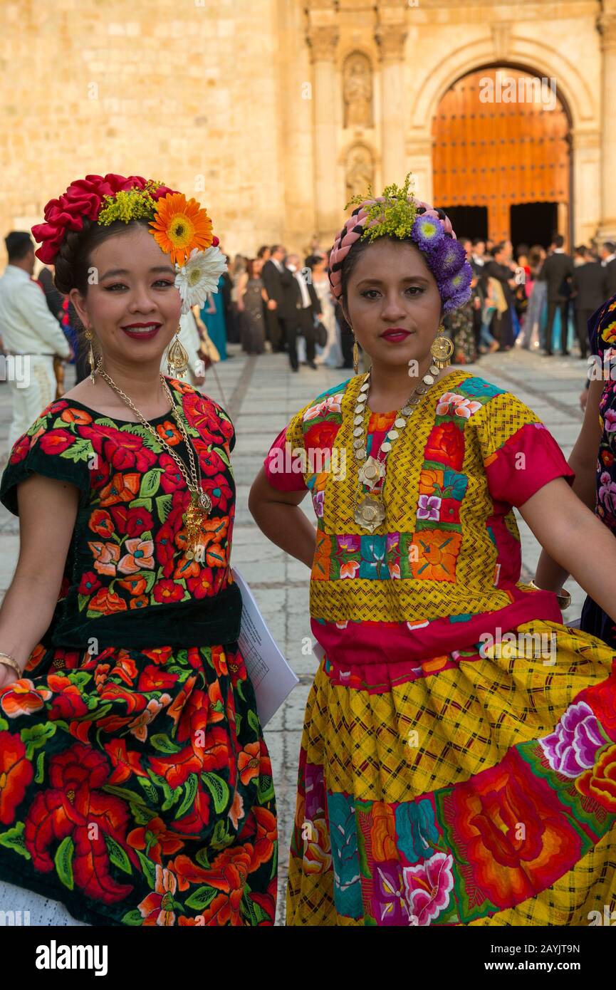 Women posing dressed in regional costumes in the city of Oaxaca de ...