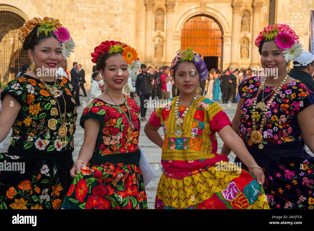Women posing dressed in regional costumes in the city of Oaxaca de ...