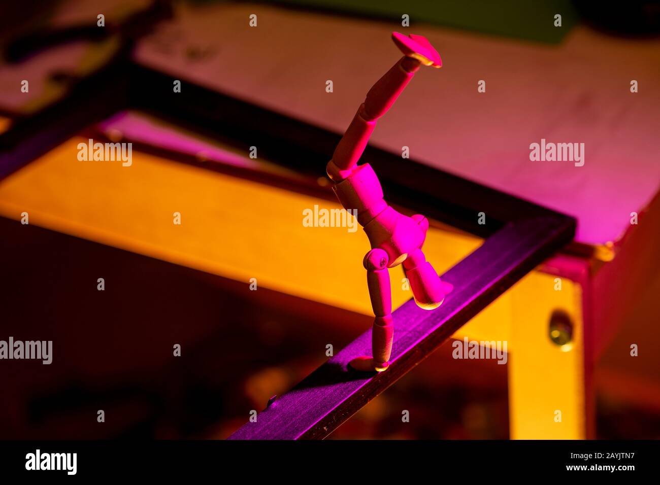 Wooden manikin balancing on picture frame- concept of creativity Stock ...