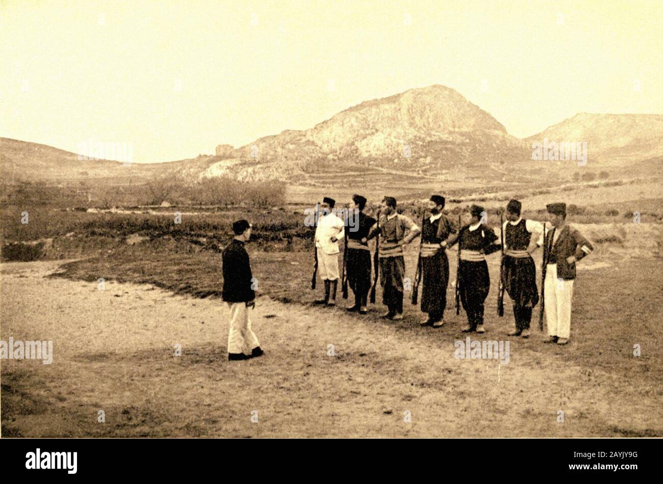 French Corporal Drilling Cretan Village Guards (1898). Frontispiece Stock Photo - Alamy