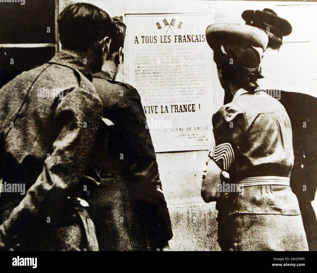 French men and women read a French war poster written by General de ...