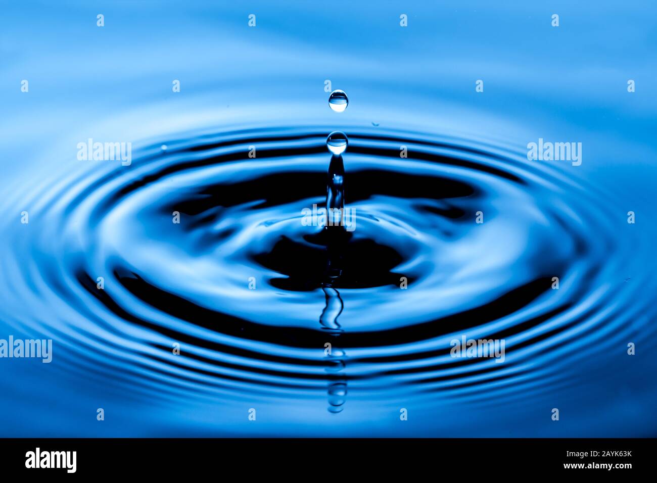 Water with milk dripping or water ripples in a pond. waves of rippling ...