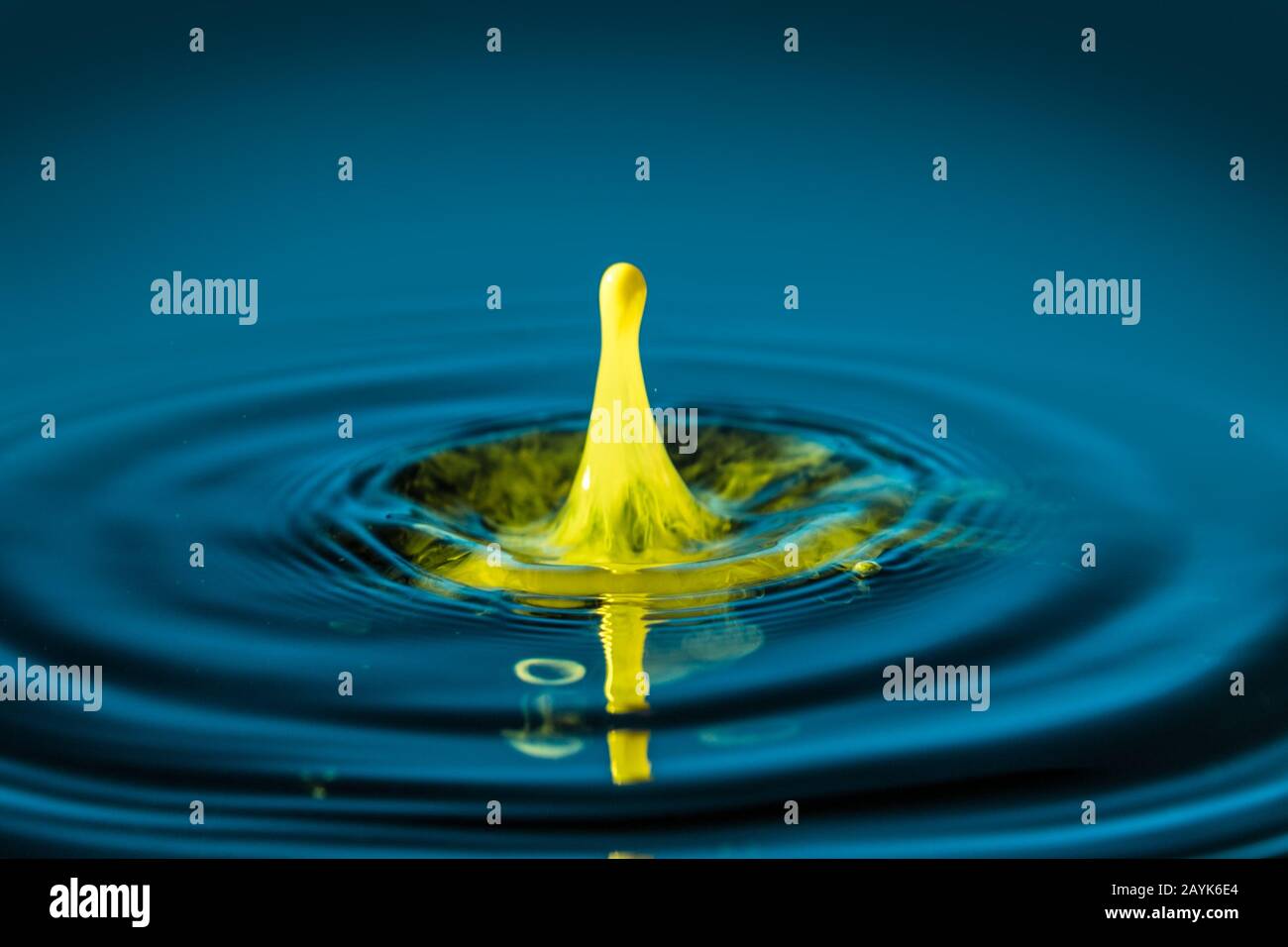 Water with milk dripping or water ripples in a pond. waves of rippling ...