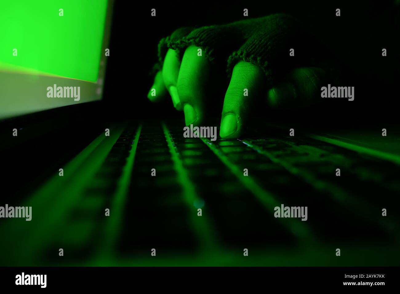 hacker hand stealing data from laptop, cyber crime Stock Photo - Alamy