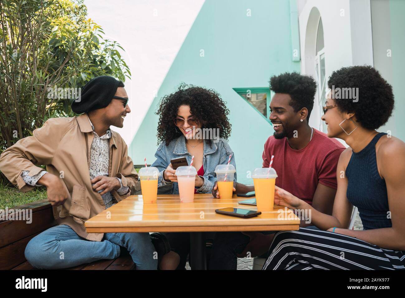 Portrait happy diverse friends drinking hi-res stock photography and ...