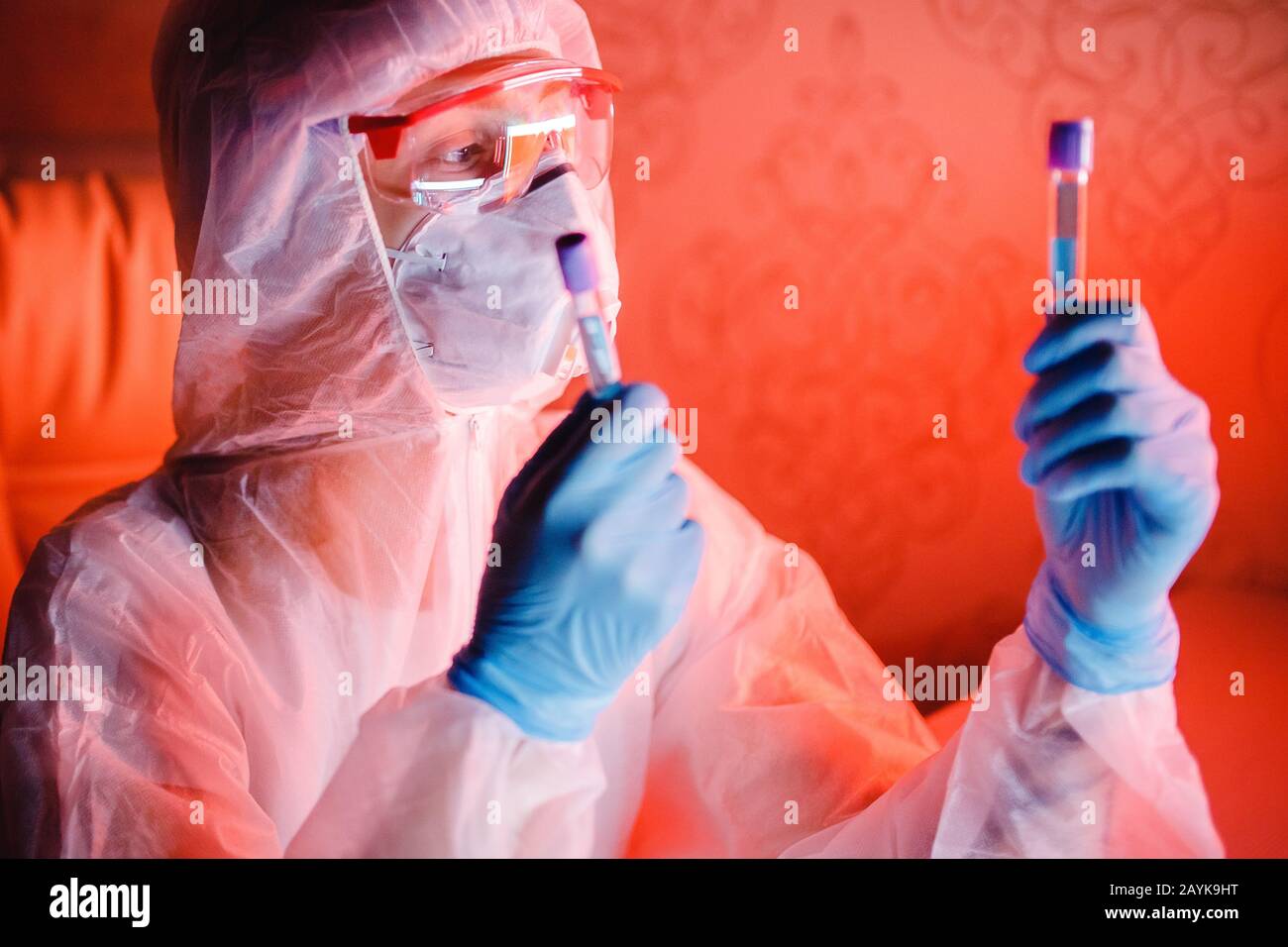 Female research scientist uses computer blood test tubes in modern ...
