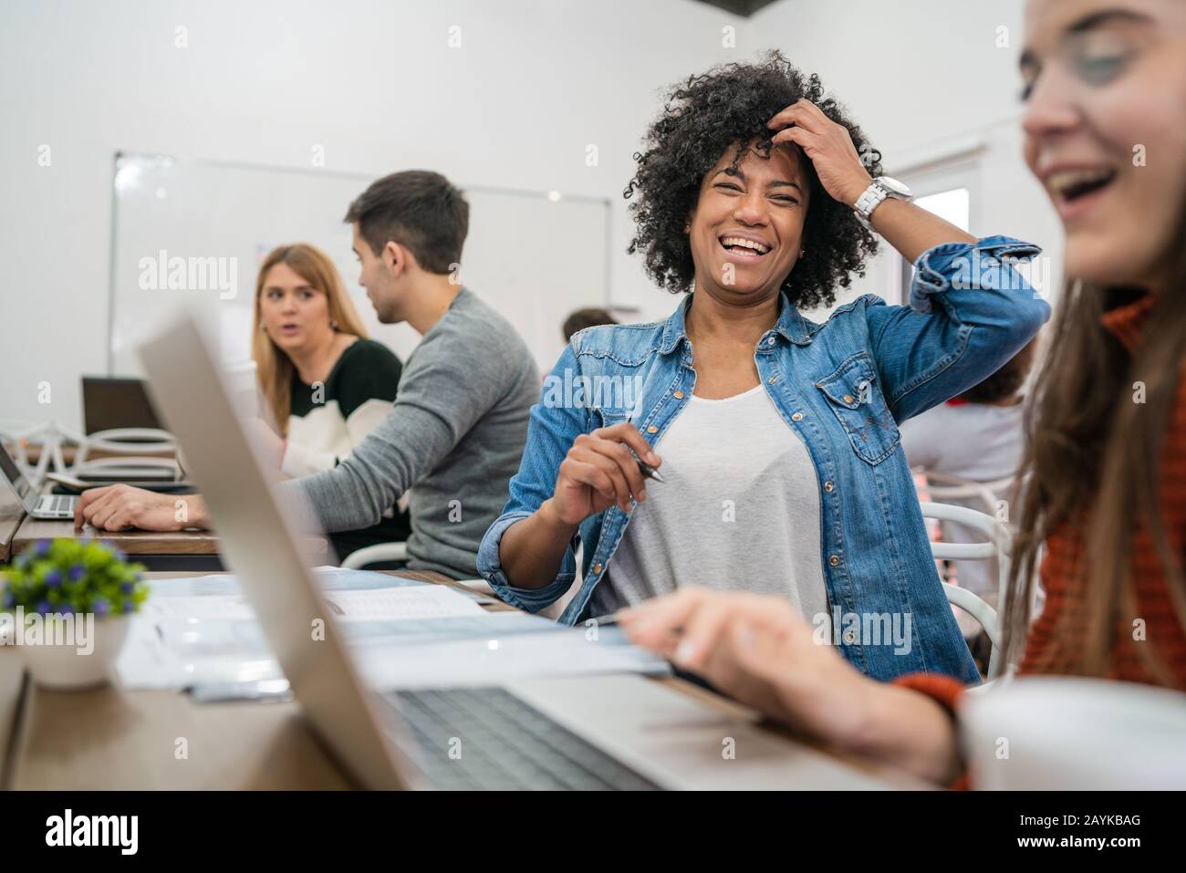 Two people discussing sketch project hi-res stock photography and ...