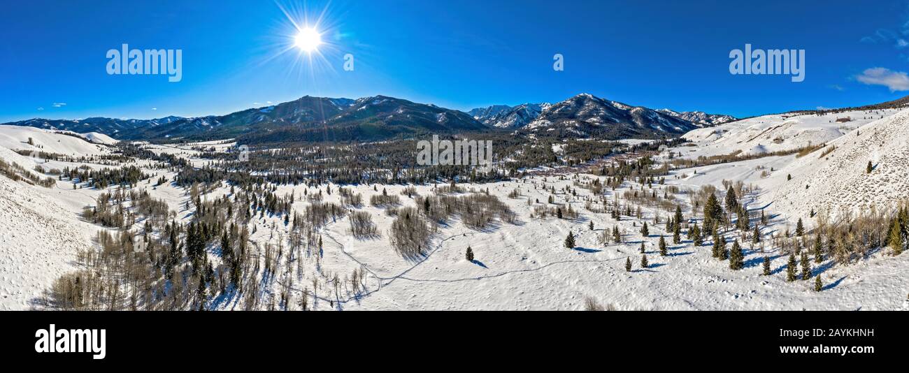 Panoramic Winter Landscape with Snow-Covered Terrain and Sunny Mountain ...