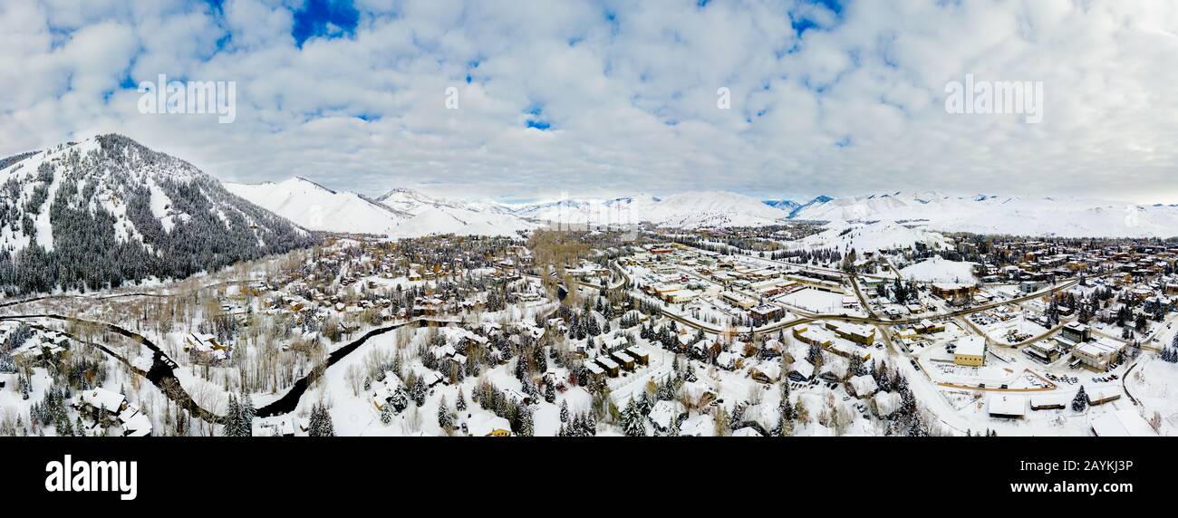 Panoramic Winter Aerial of a Snowy Mountain Valley Town With Rolling ...