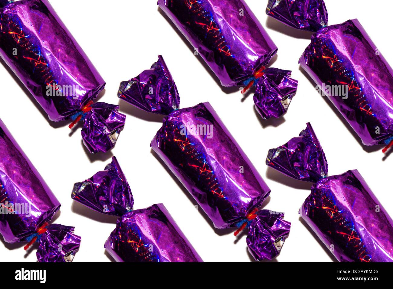 Abstract candy texture. Candy wrapped in multicolored foil wrappers ...