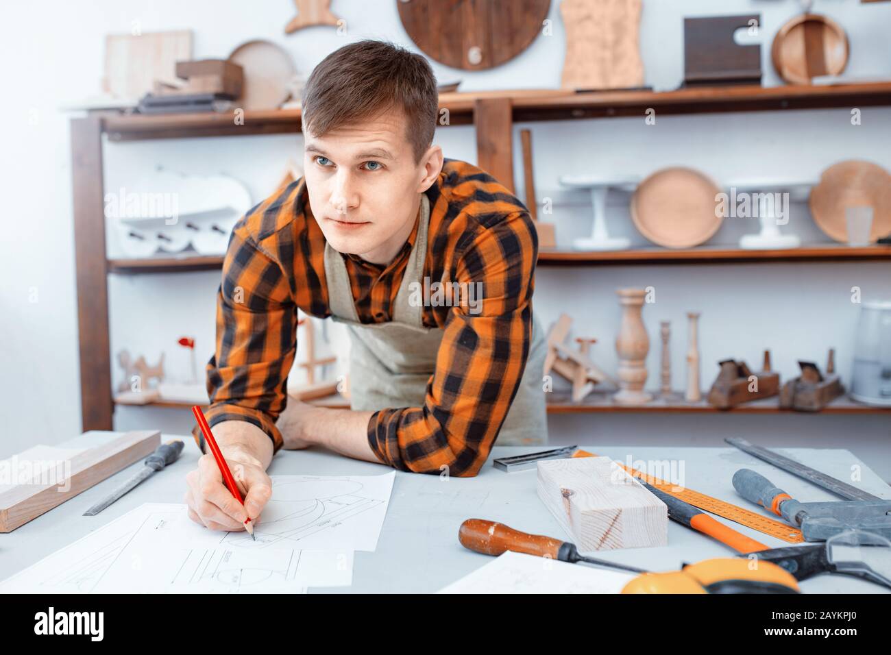 Man makes pencil drawing in hi-res stock photography and images - Alamy