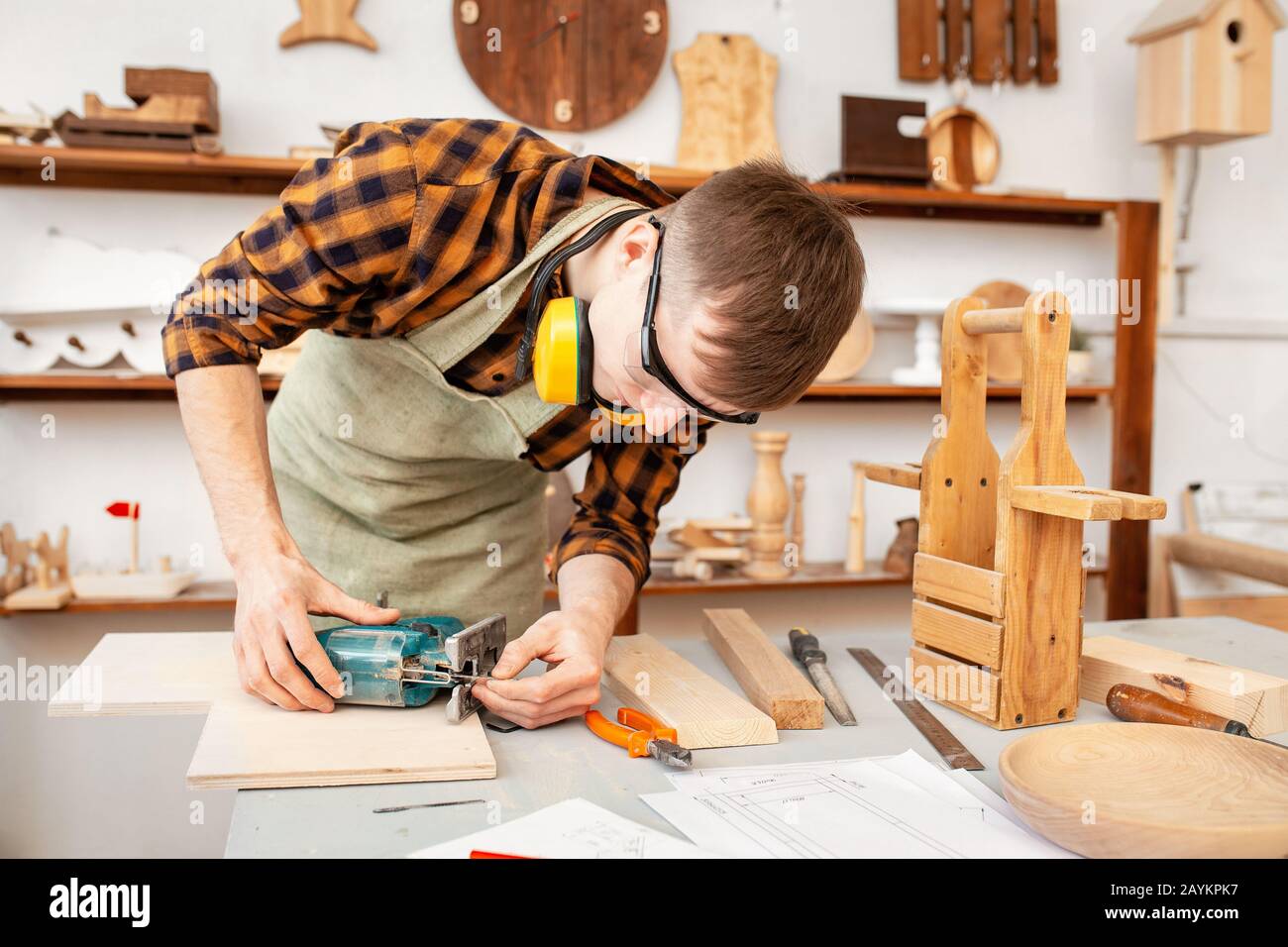 Working with a jigsaw hi-res stock photography and images - Alamy