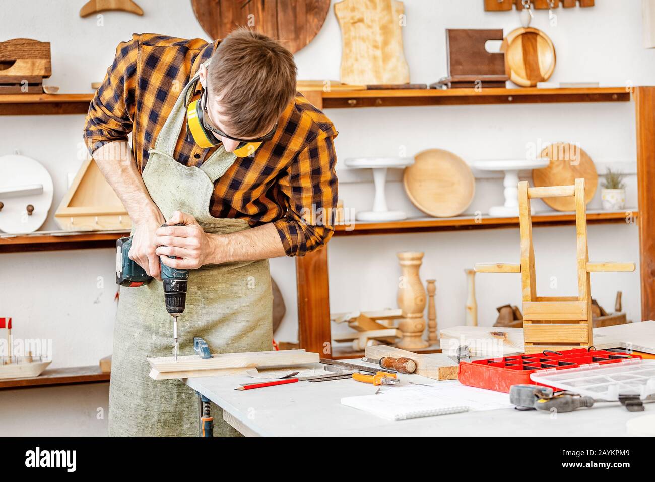 Man carpenter at work in home or workshop. Handcraft experience concept ...