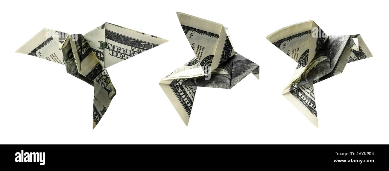 Hundred dollar bills in the shape of birds in flight on a white ...